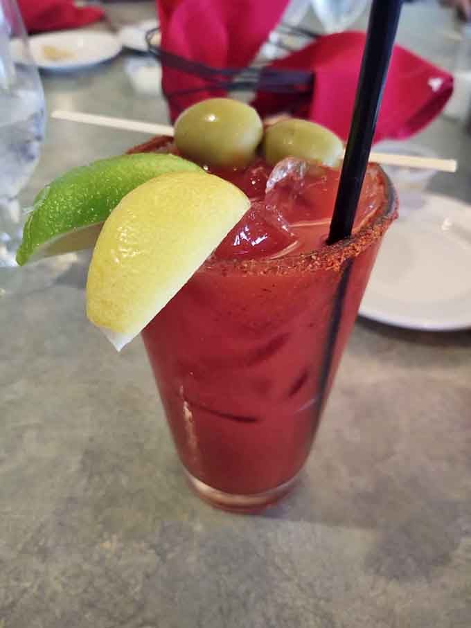 This loaded Bloody Mary with its citrus garnishes and olives looks like a salad bar crashed into a cocktail glass, wonderfully.