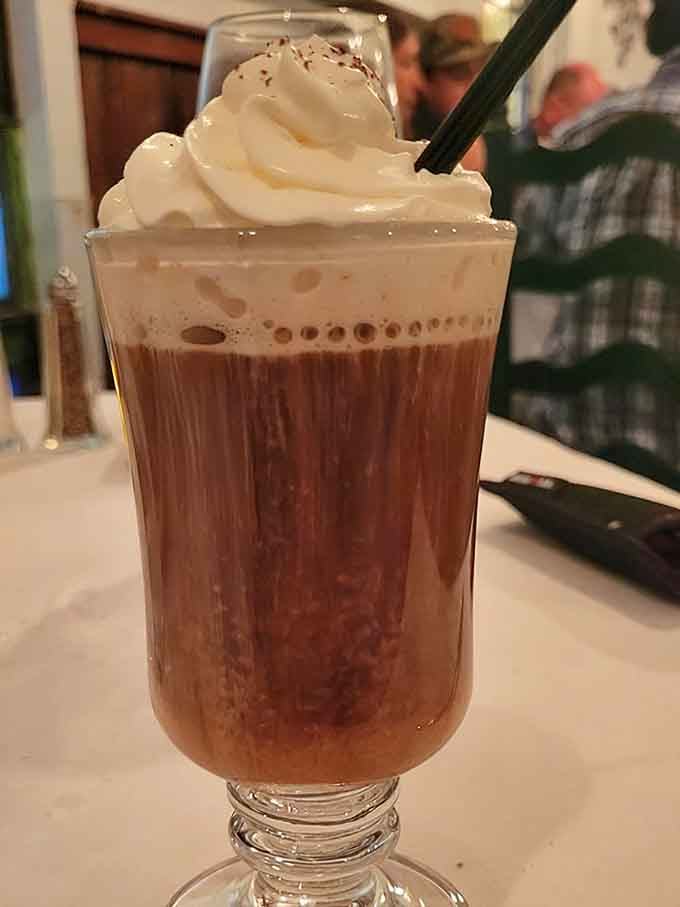 Irish coffee topped with whipped cream, the perfect marriage of caffeine and comfort in one delightful glass of happiness.