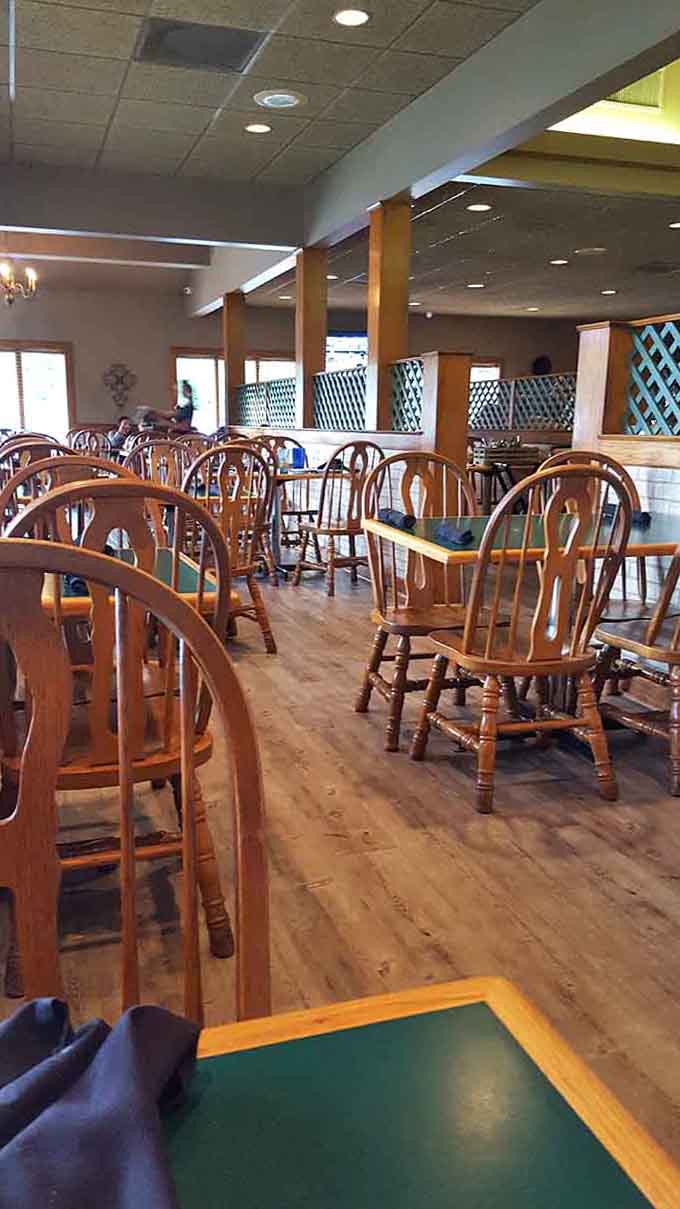 Comfortable wooden chairs and spacious tables create the kind of relaxed atmosphere where lingering over coffee feels just right.