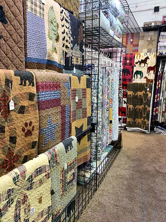 Handcrafted quilts featuring wildlife patterns that bring cozy cabin vibes to any bedroom, regardless of actual wilderness proximity.