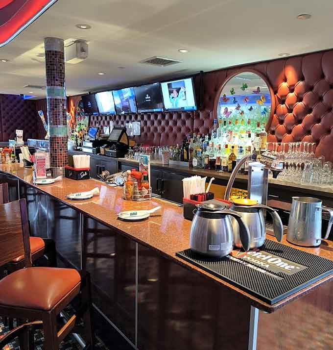 The bar area gleams with promise, offering liquid refreshment to complement your meal or your Monday.