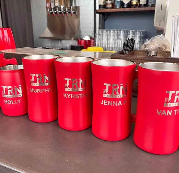 Custom tumblers lined up like soldiers, ready to serve drinks to golfers who take their beverages seriously always.