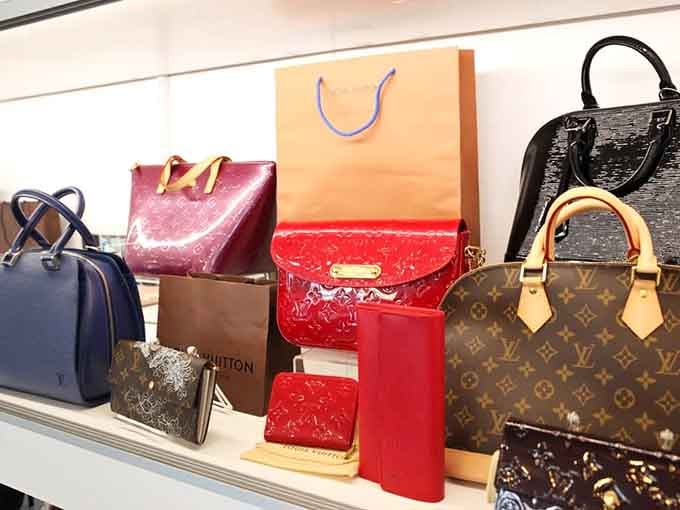 Louis Vuitton monogram sits casually next to patent leather red beauties, proving one person's closet cleanout is another's jackpot discovery.