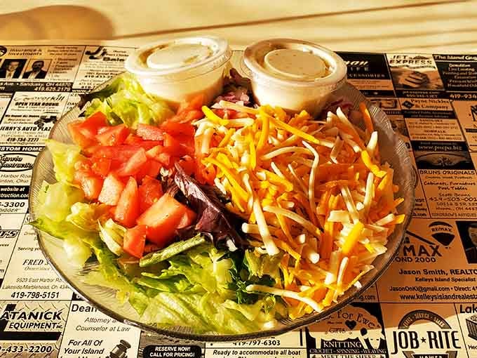 Fresh salad loaded with toppings and shredded cheese, because even island dining needs its vegetables sometimes.