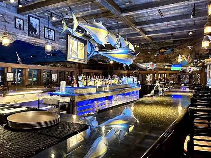 The bar area features a marlin overhead because subtlety took the night off when they designed this place.