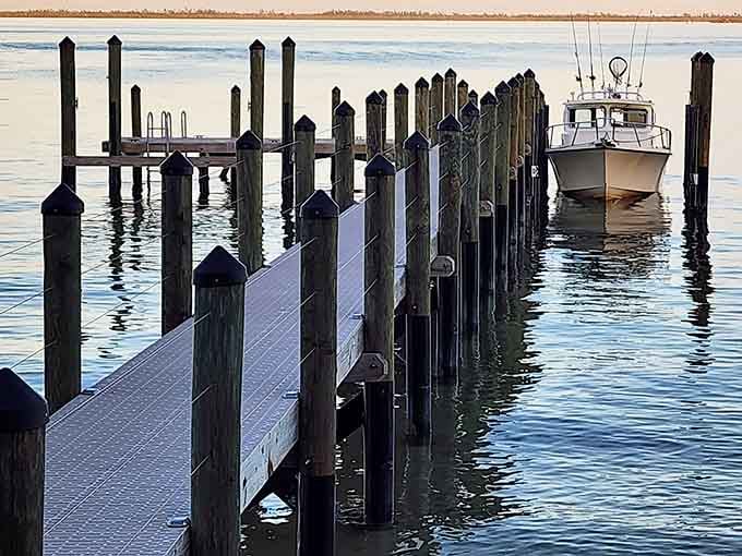 Wooden docks stretch into calm waters where boats rest peacefully, waiting for their next adventure across Pine Island Sound.