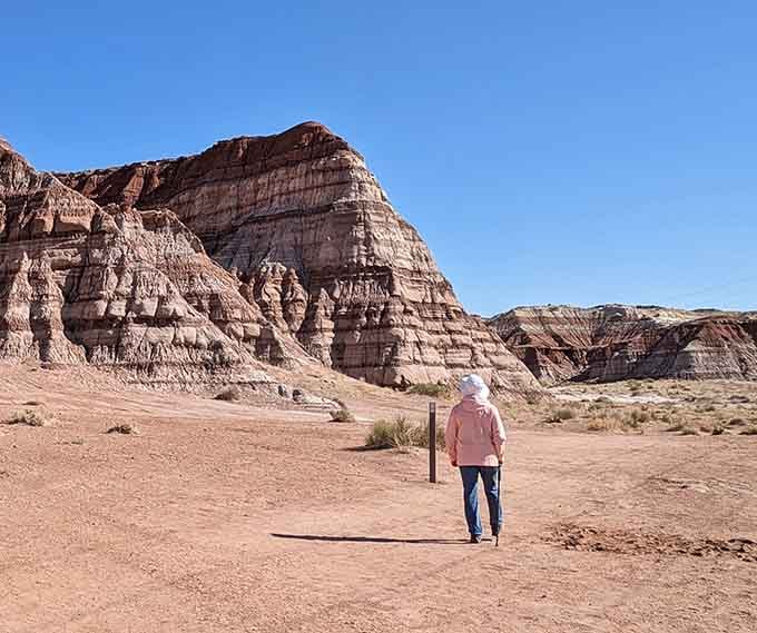 That lone hiker gives you scale for just how massive these striped geological wonders truly are.