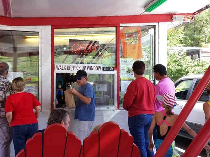 The walk-up window where dreams come true and hunger meets its match, one charcoal-grilled burger at a time.