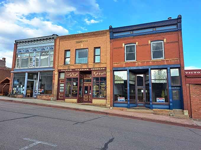 These storefronts wear their history like badges of honor, each facade telling century-old tales.