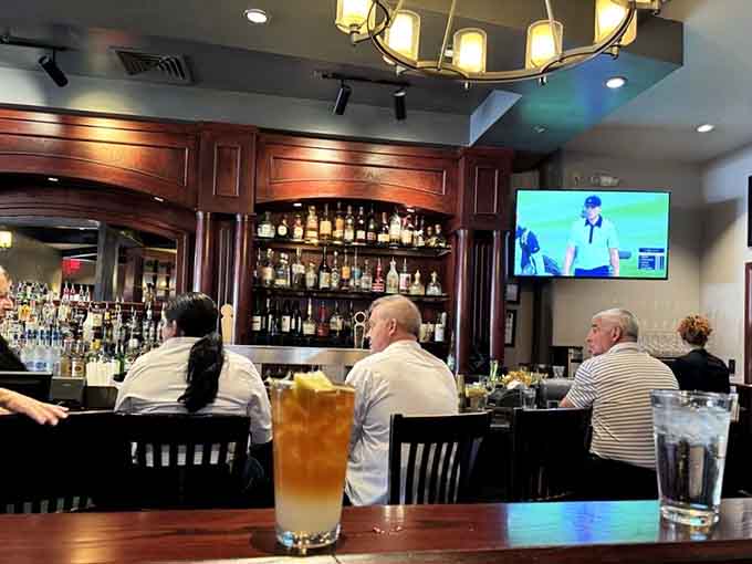 The bar area where good decisions go to retire and great conversations come to flourish beautifully.