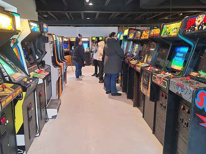 Classic cabinets including Mario Bros. stand shoulder to shoulder, creating a museum you can actually play instead of just admiring quietly.