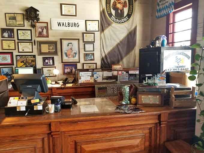 The order counter decorated with local memorabilia and German flags sets the tone before you even see the menu.