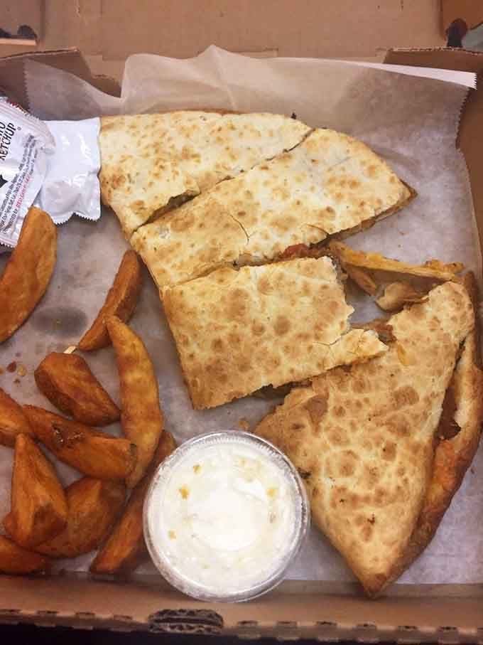 Crispy quesadilla triangles with golden fries, this combo delivers that perfect crunch and melty cheese satisfaction we all crave.