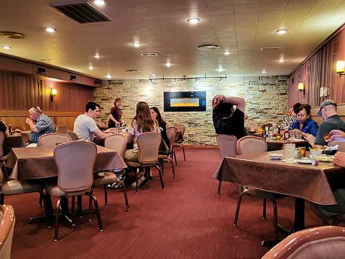 Another angle reveals more of that glorious wood paneling and comfortable seating built for lingering over dinner properly.