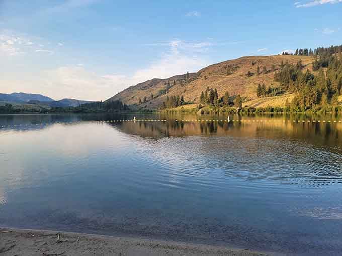 Pearrygin Lake's mirror-smooth water reflects mountains so perfectly, even your phone camera becomes an accidental landscape artist here.