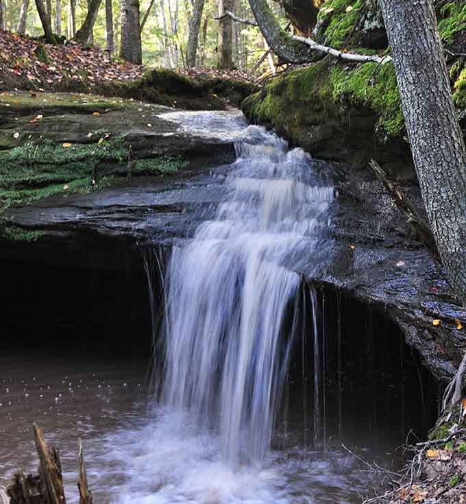 Houghton Falls tumbles over ancient rock layers, offering cool mist and the soundtrack of rushing water.