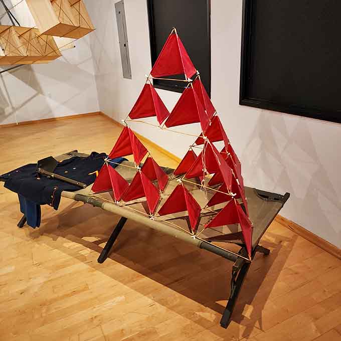 Tetrahedral kites stacked in red pyramids demonstrate that Alexander Graham Bell wasn't just about inventing telephones.