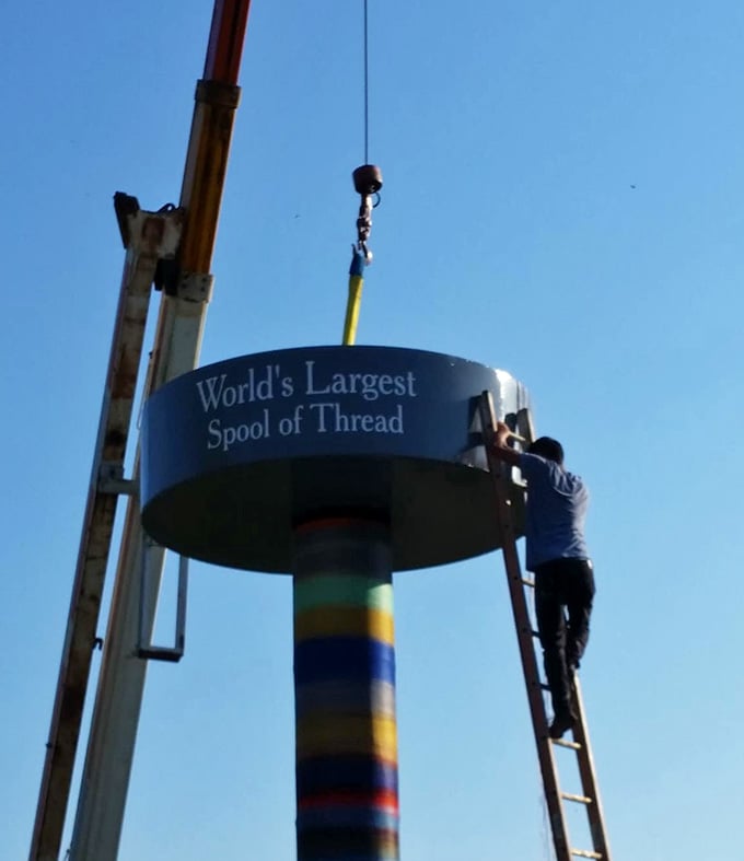 Someone had to climb up there and make it happen, turning an ordinary water tower into extraordinary art.