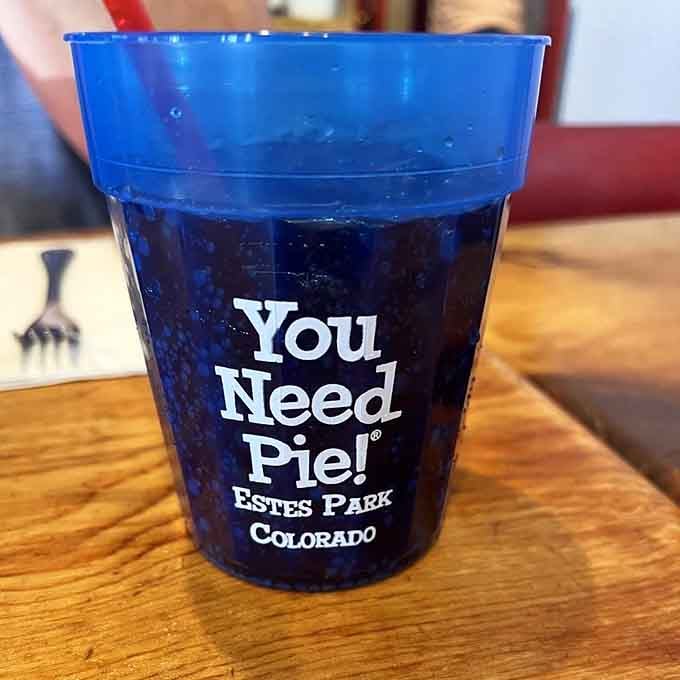 Even the soda cups proudly declare the diner's philosophy, because branding matters when you're this confident.