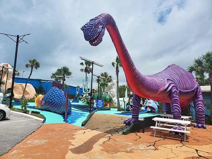 That purple dinosaur towering over the mini golf course looks like Barney's rebellious cousin who joined the circus.