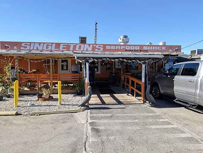 That covered outdoor setup under corrugated metal speaks to generations of beachgoers seeking simple, satisfying seafood.