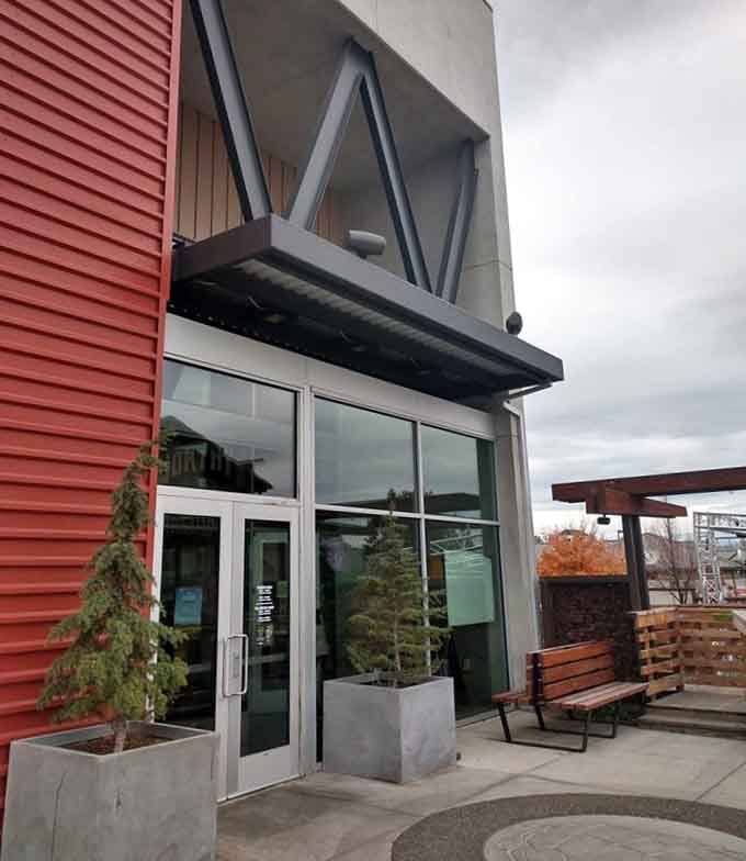 Modern concrete planters and clean lines create an unexpectedly sophisticated gateway to craft beer and mountain view perfection.
