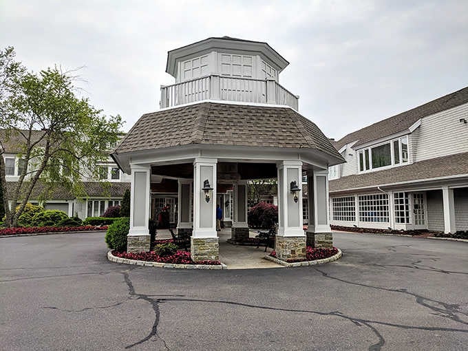 The covered portico welcomes guests like an old friend, promising sophisticated meals in a beautifully maintained setting.