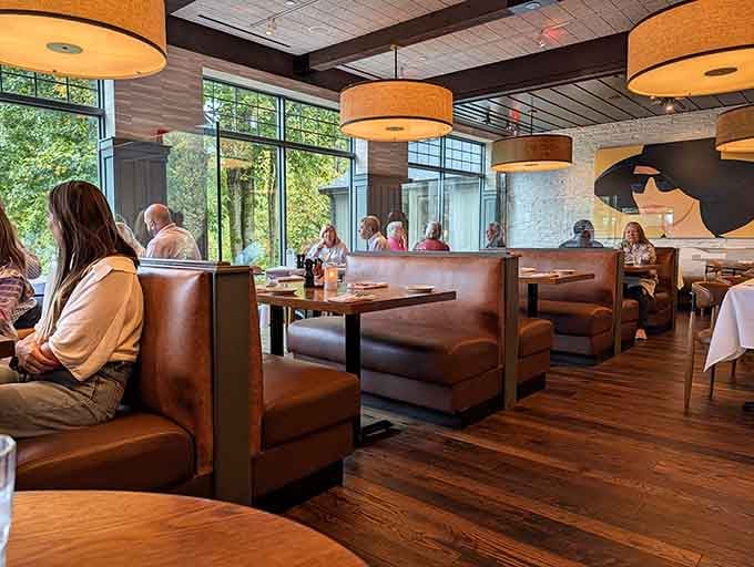 Large windows frame nature's show while you enjoy yours, proving dinner theater doesn't need a stage.