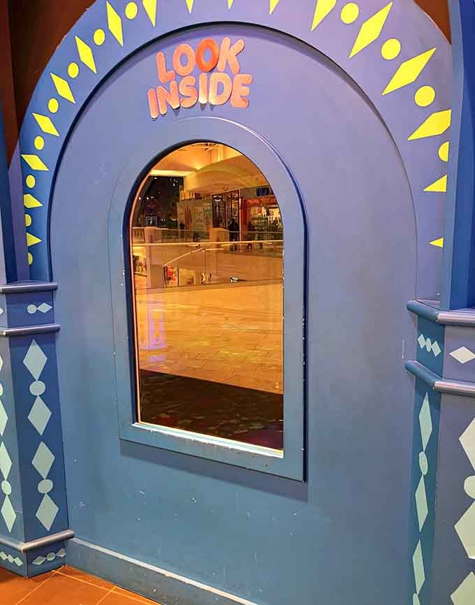 That cheerful "LOOK INSIDE" invitation is basically daring you to question everything you thought you knew about hallways.