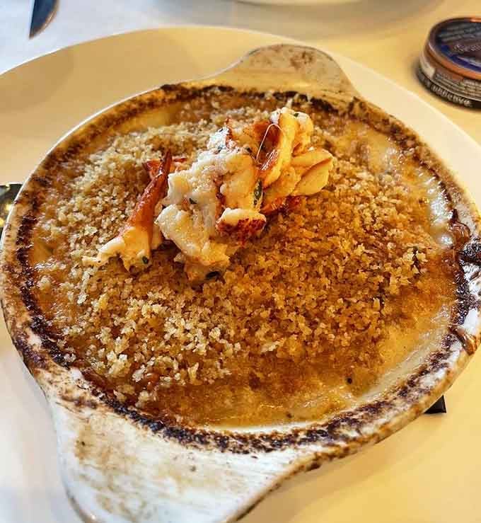 Au gratin potatoes topped with lobster meat, because sometimes regular potatoes just won't cut it anymore.