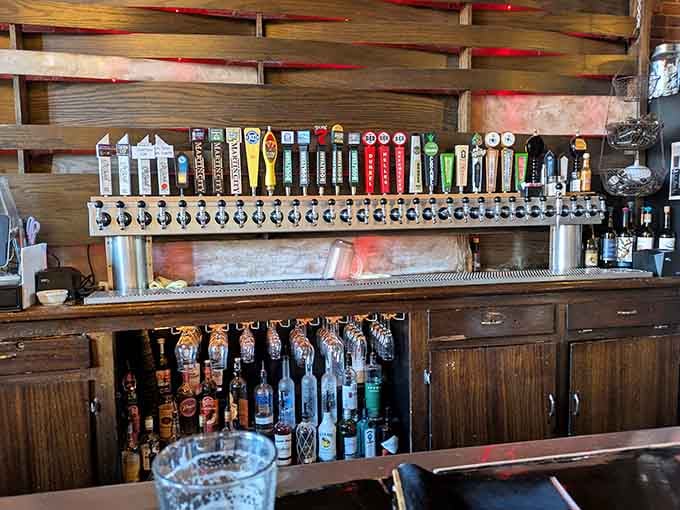 The impressive tap selection behind the bar proves this taproom takes its beverages as seriously as its steaks.