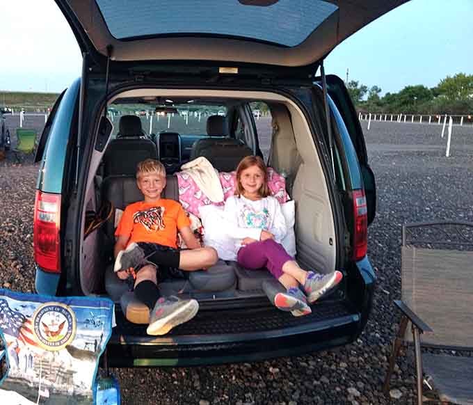 Tailgate seating done right, with blankets and smiles that prove the best theater is your own trunk.