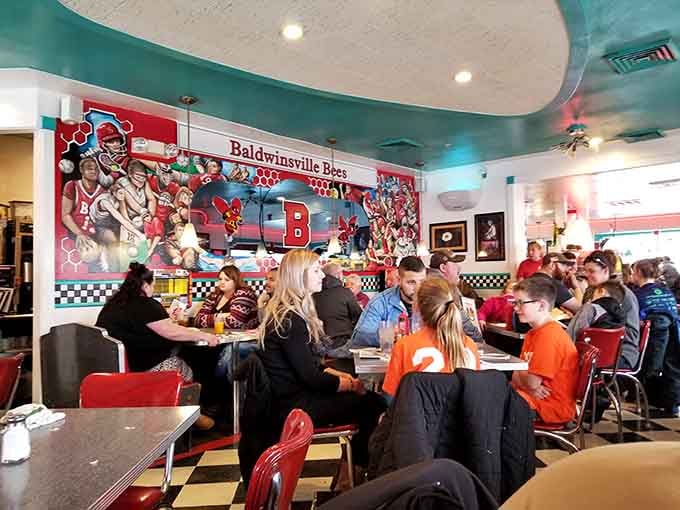 Families, friends, and solo diners alike find their happy place in these classic red booths every single day.