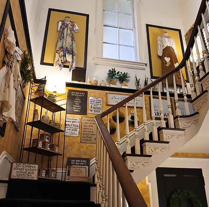 That stunning staircase with vintage clothing displays and thoughtful decor shows this building's got stories beyond just great food.