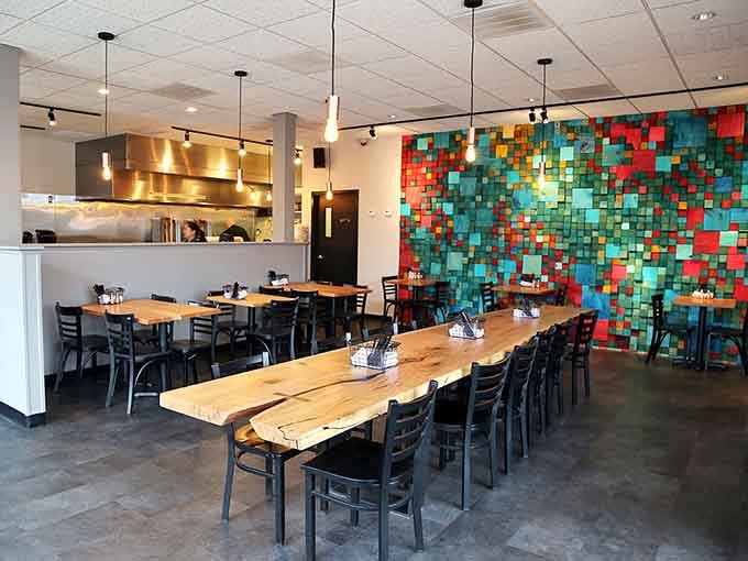 Long communal tables and that stunning mosaic wall create a dining room that's as Instagram-worthy as the food itself.