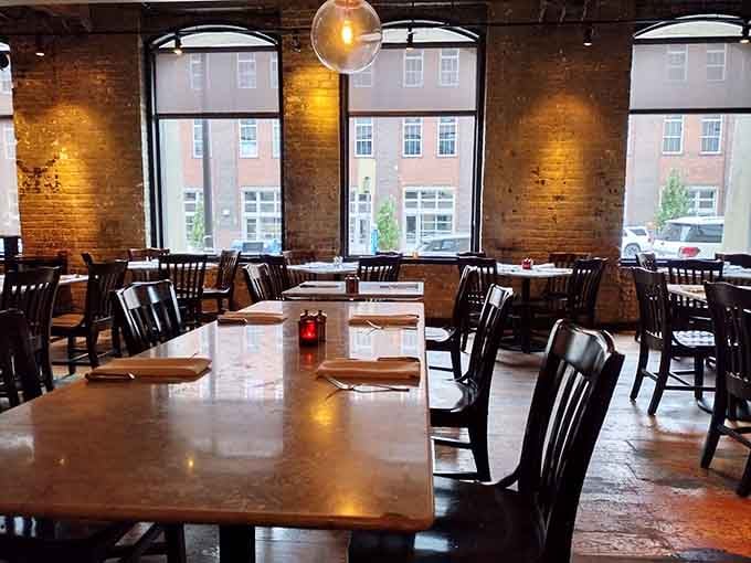 Sunlight streaming through arched windows onto marble tables, creating the kind of ambiance money usually can't buy.