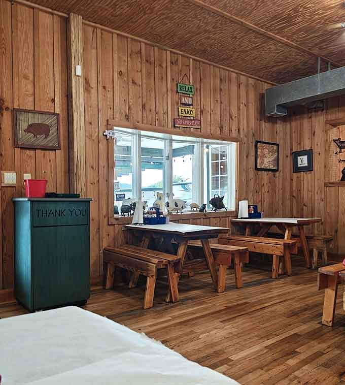 Simple wooden benches and tables create the perfect no-frills setting for some seriously fancy-tasting barbecue here.