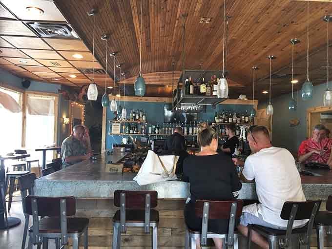 The bar area gleams with promise, ready to mix up whatever your heart desires after dinner.