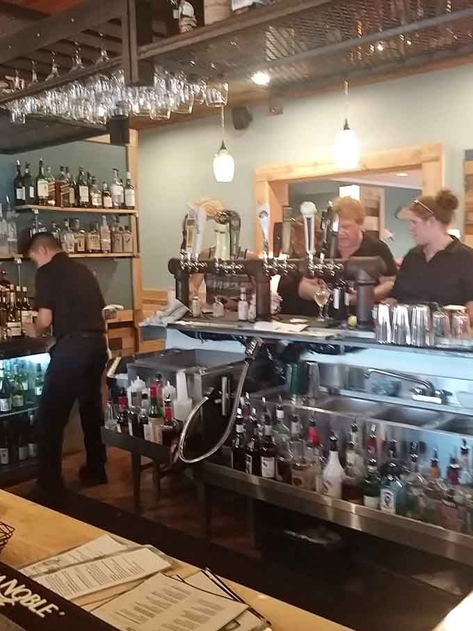 The bar area where friendly folks mix drinks and create the kind of atmosphere that makes you want to stay awhile.