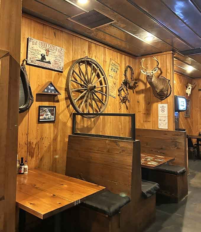 Booth seating with a view of hunting memorabilia—because nothing says Georgia quite like comfort meeting tradition perfectly.