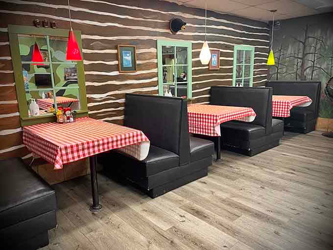 Booth seating with red checkered tablecloths adds a touch of classic diner charm to the space.
