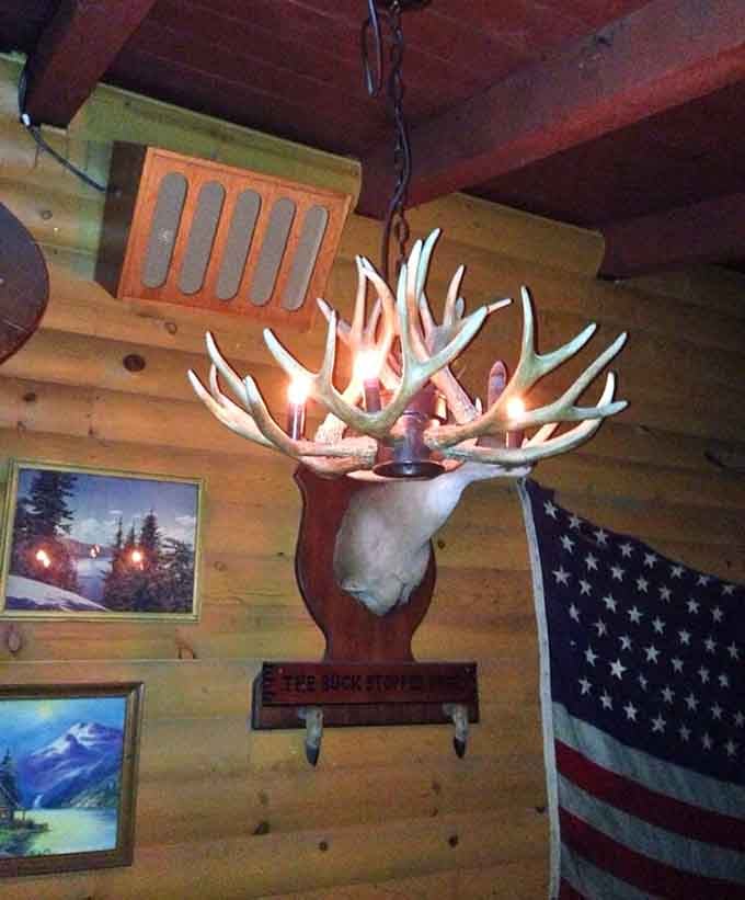 That antler chandelier labeled "The Buck Stopped Here" proves someone here has both excellent taste and dad-joke energy.