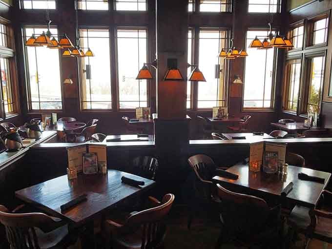 Mission-style lighting and booth seating create that rare combination of casual comfort and genuine quality dining atmosphere.