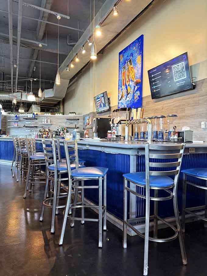 Counter seating with colorful art means you can watch the kitchen magic while caffeinating into full consciousness.