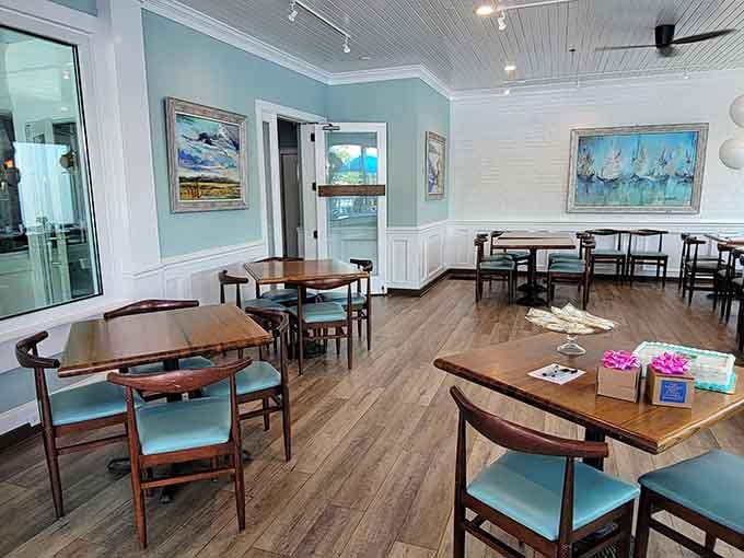 Coastal artwork and soothing colors create a waiting area so pleasant, you almost don't mind if your table's running late.