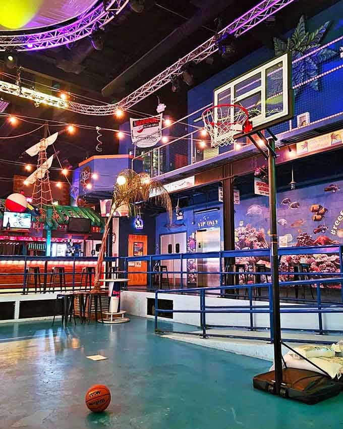 Yes, that's a basketball hoop inside the restaurant, because why shouldn't dinner include a little friendly competition?