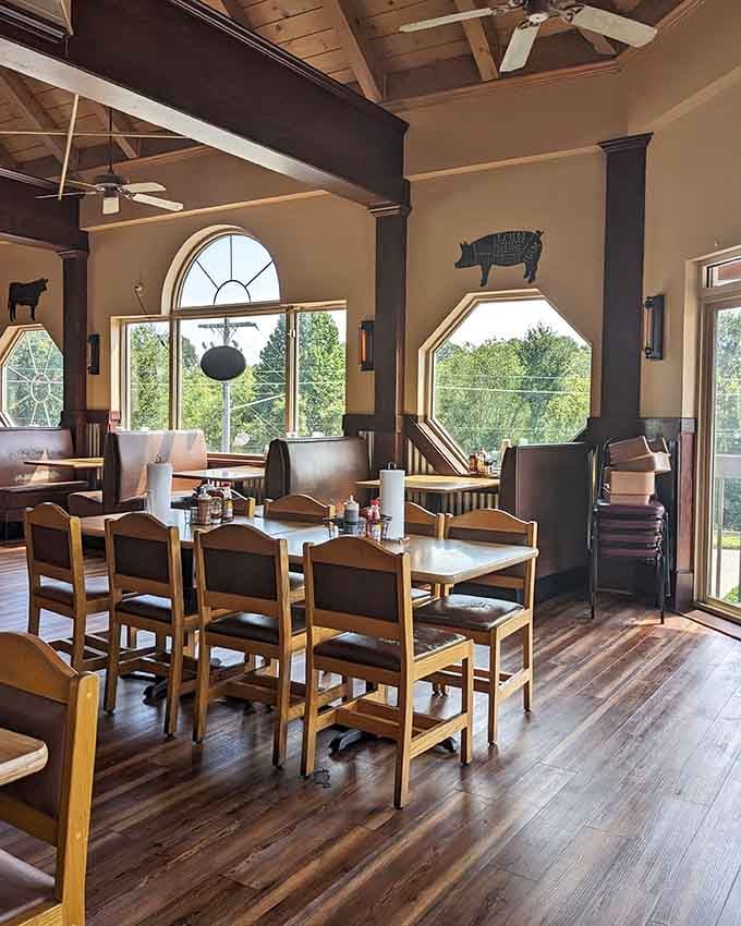 Those arched windows and pig decorations create an atmosphere that's equal parts rustic charm and surprising architectural sophistication.