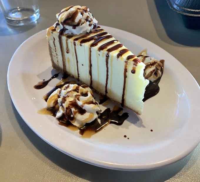 Towering cheesecake drizzled with chocolate and caramel makes dessert menus seem like gentle suggestions, not options.