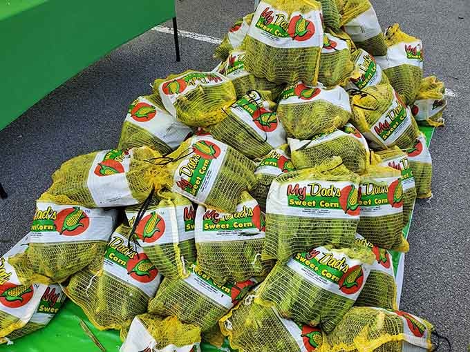 Sweet corn piled high in mesh bags, just waiting to become the best thing you've grilled all summer long.