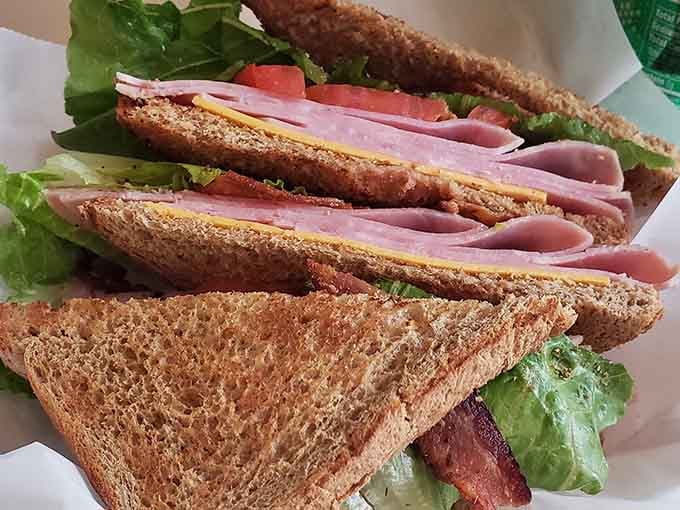 The club sandwich stacked high with ham, bacon, and all the fixings proves that classics become classics for good reason.